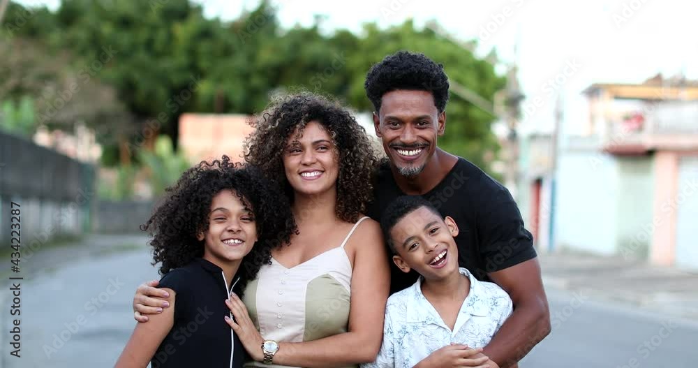 Happy African family portrait standing for photo outside. Cheerful ...