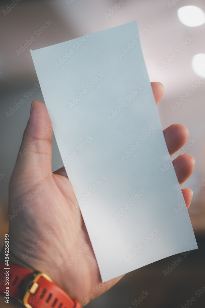 Man holding of empty bill receipt grocery shopping list of supermarket ...