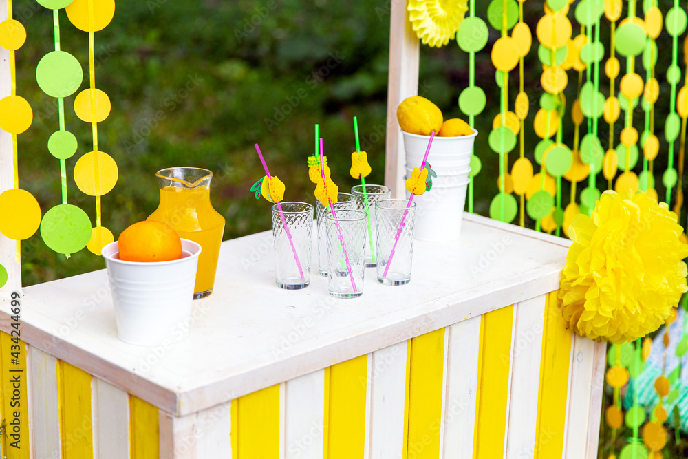 Lemonade stand set up in front yard. Production and sale of orange ...