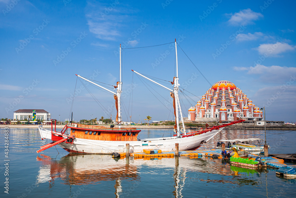 Traditional Phinisi boat and Masjid 99 Kubah (99 Domes Mosque), icon ...