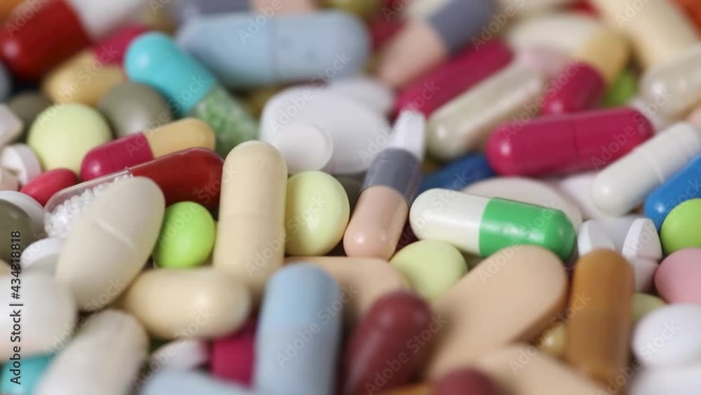 Closeup loop of rotating pile of medication pills Stock Video | Adobe Stock