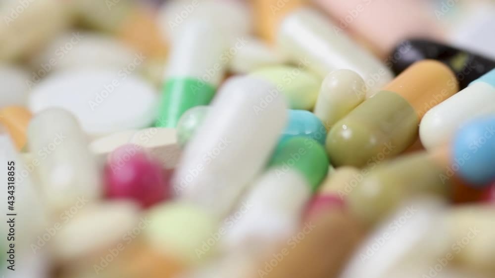 Closeup shot of rotating pile of colorful pills (HD) Stock Video ...