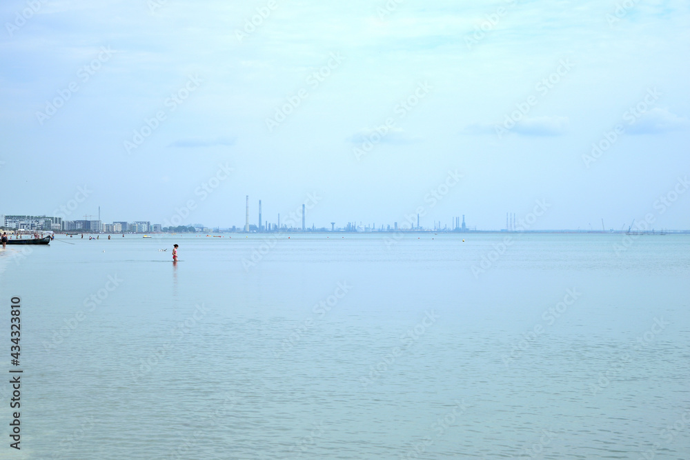 seascape at evening with industrial platform (oil refinery ...