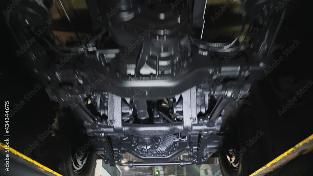 A truck is Driving Forwards above the Inspection Pit. Manufacturing the ...