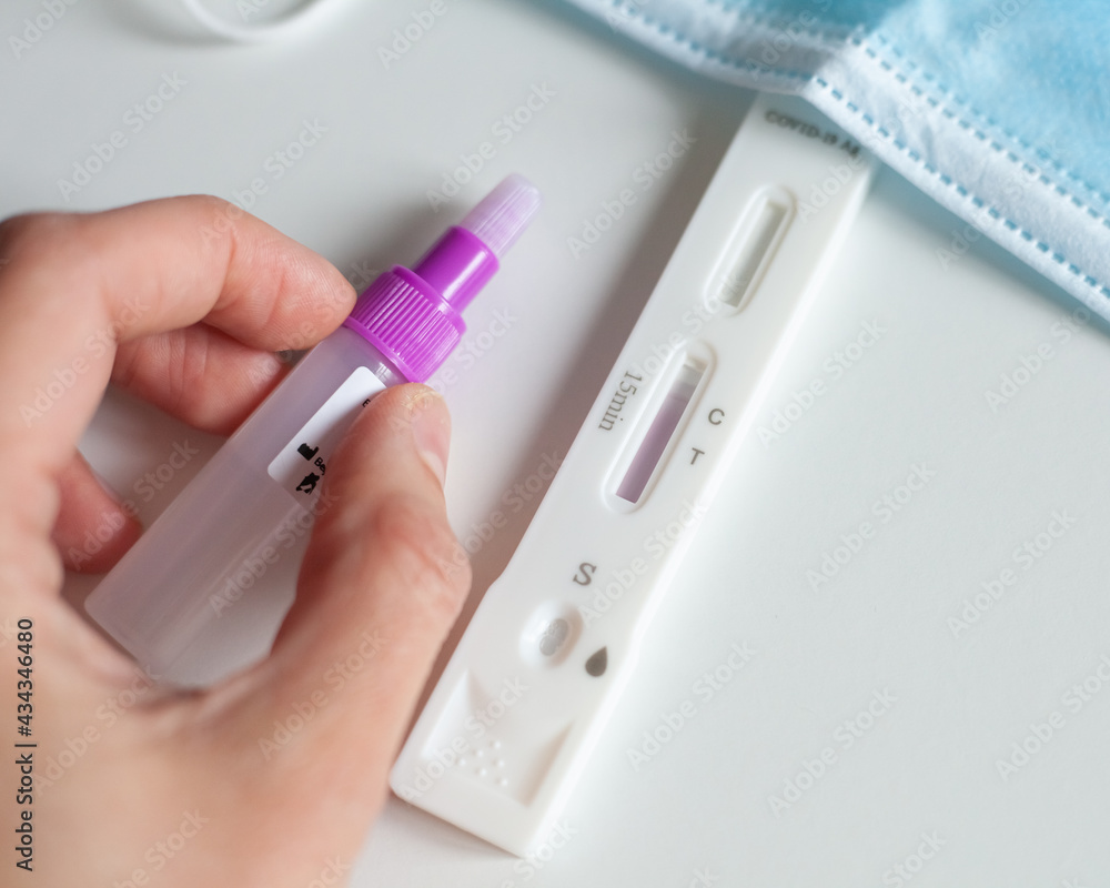 close up of hand, person using swab test covid-19, antigentest, self ...