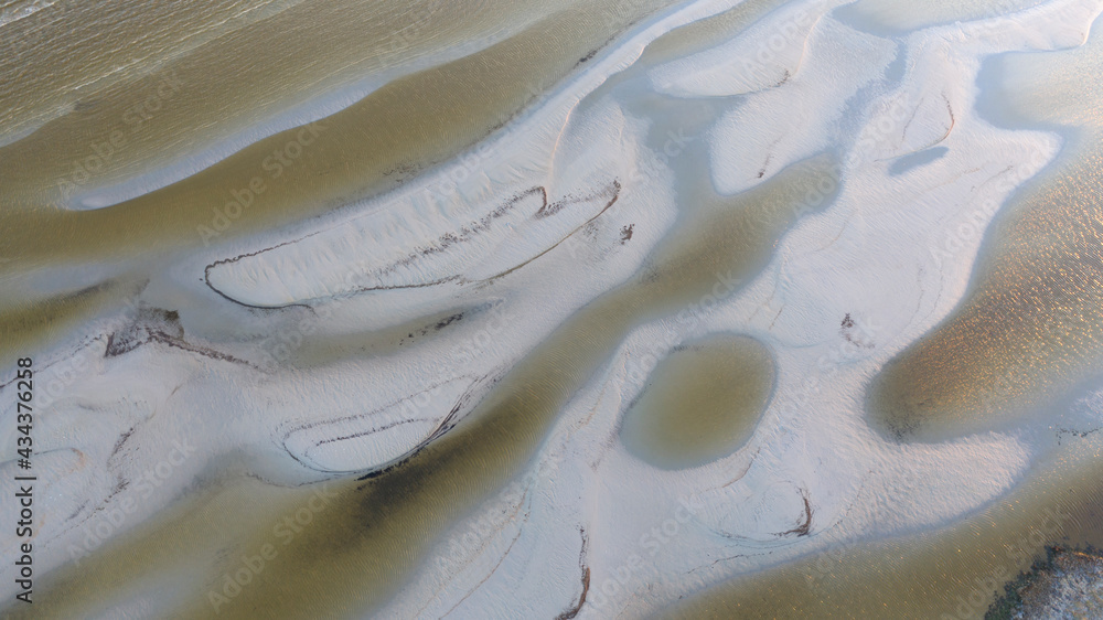 Aerial top down view to the patterns of the coastal natural sandbar ...