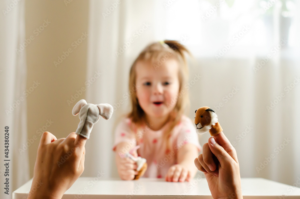 Little expressive girl and his brother playing theater with animal ...