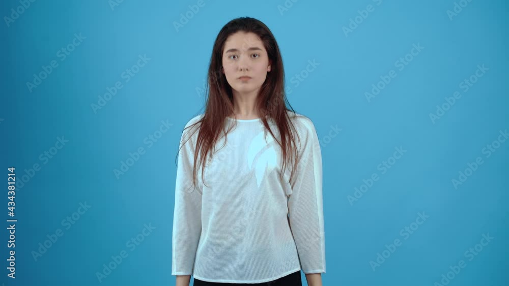 The portrait of a charismatic young woman who, as a sign of respect ...