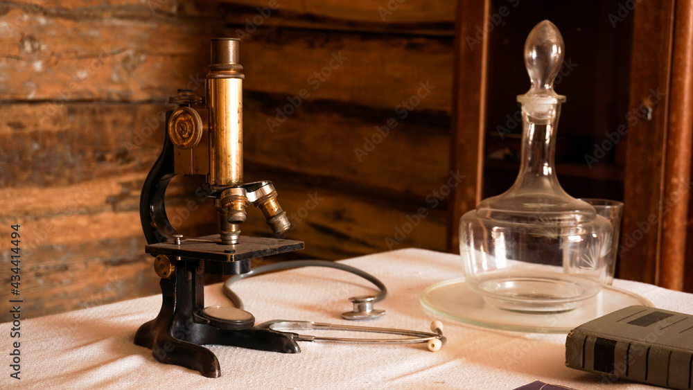 Ancient microscope in an old authentic laboratory. Rural old medical ...