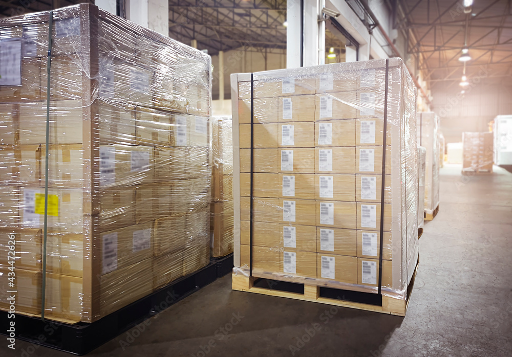 Interior of Storage Warehouse. Stacked of Package Boxes Wrapped Plastic ...