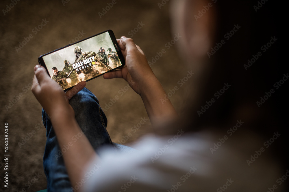 Illustrative editorial image of child playing Call of Duty mobile Stock ...