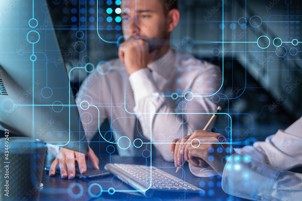 Two colleagues in formal wear working together to optimize business ...