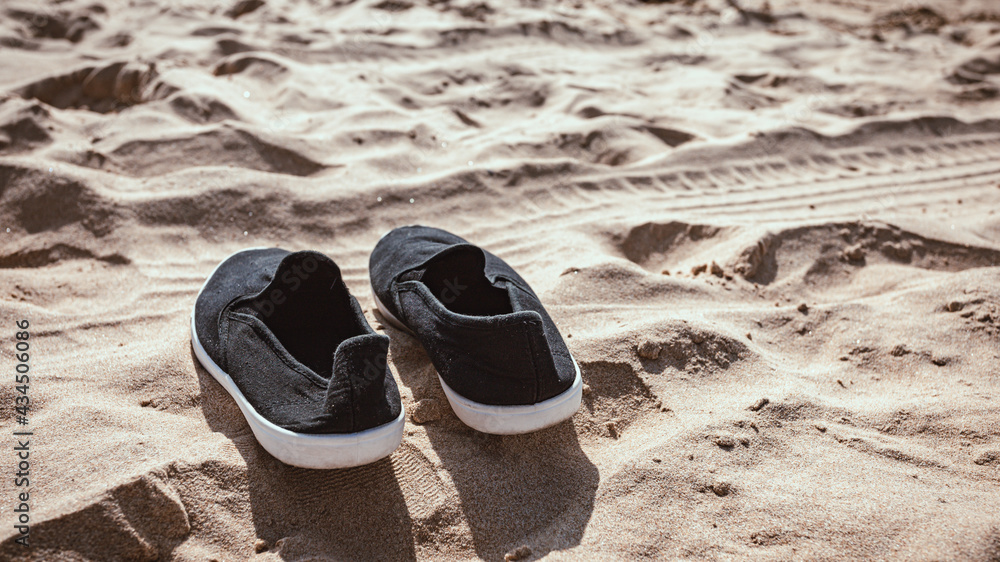 beach shoes. sand background on the beach. summer vacation beach ...