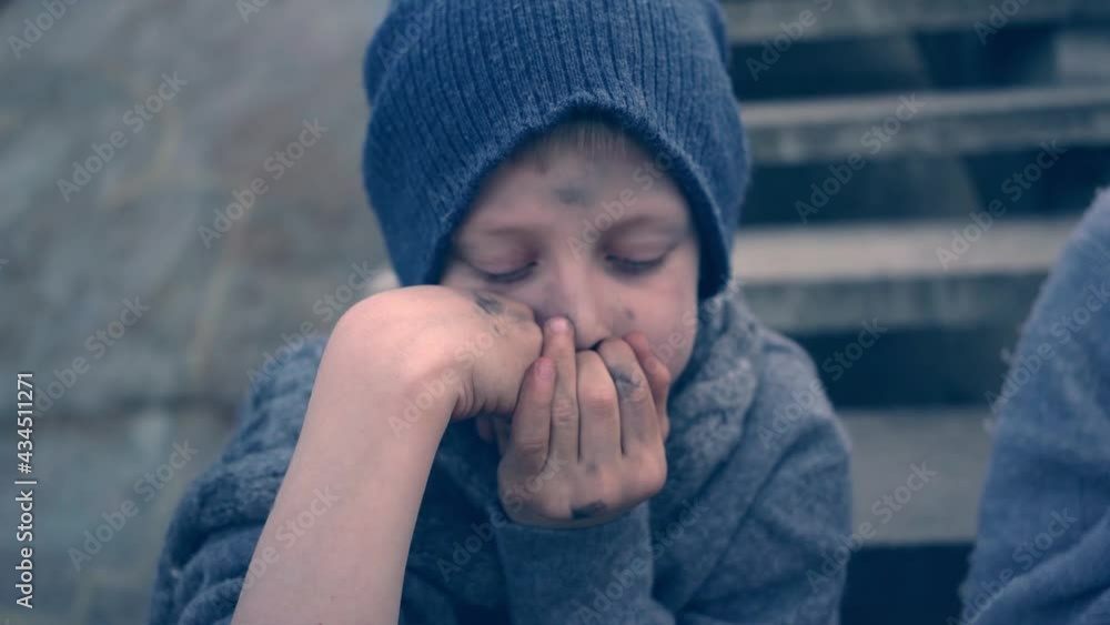 Video Stock homeless boy sits on stairs in an abandoned place migration ...