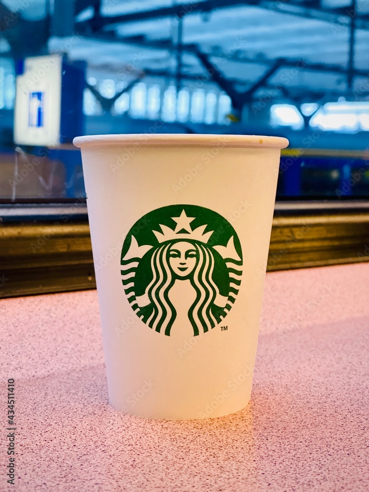 Coffee to go commuting to work on the NS train waiting at the platform ...