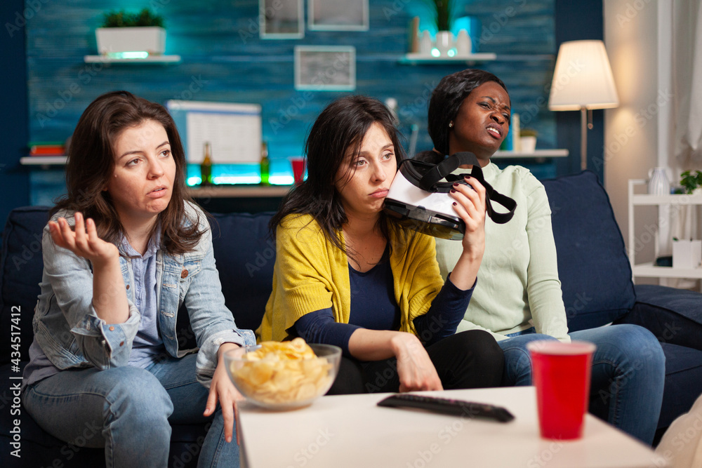 Sad women after losing virtual reality gaming competiton holding vr ...