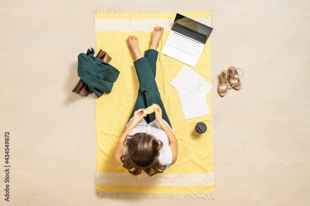 Businesswoman freelancer in office suit applying sunscreen on skin ...