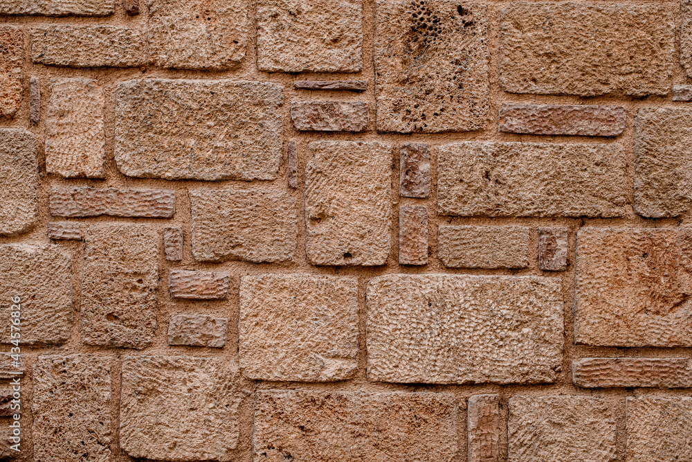 Part of wall with beautiful shell rock bricks masonry. Texture of ...