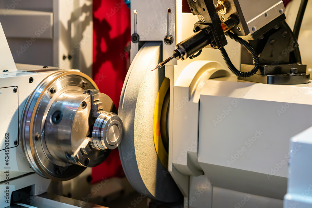 metal cylinder or workpiece clamp by 3 jaw chuck and during surface ...