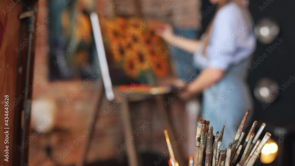 Working process in art studio. Set of painting brushes and palette ...