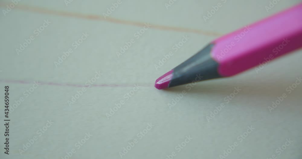 Purple graphite pencil color draws a straight line on a white ...