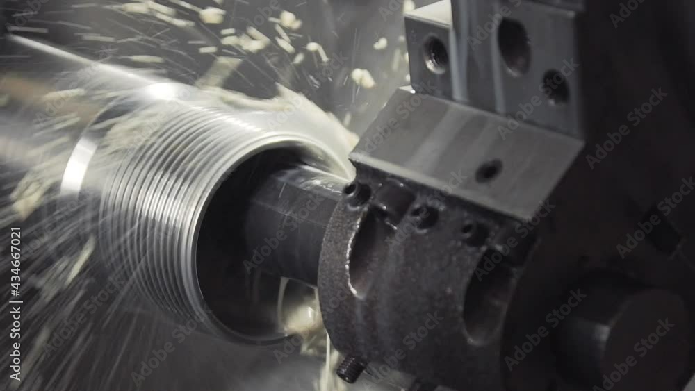 Turning lathe in action. Facing operation of metal blank on turning ...