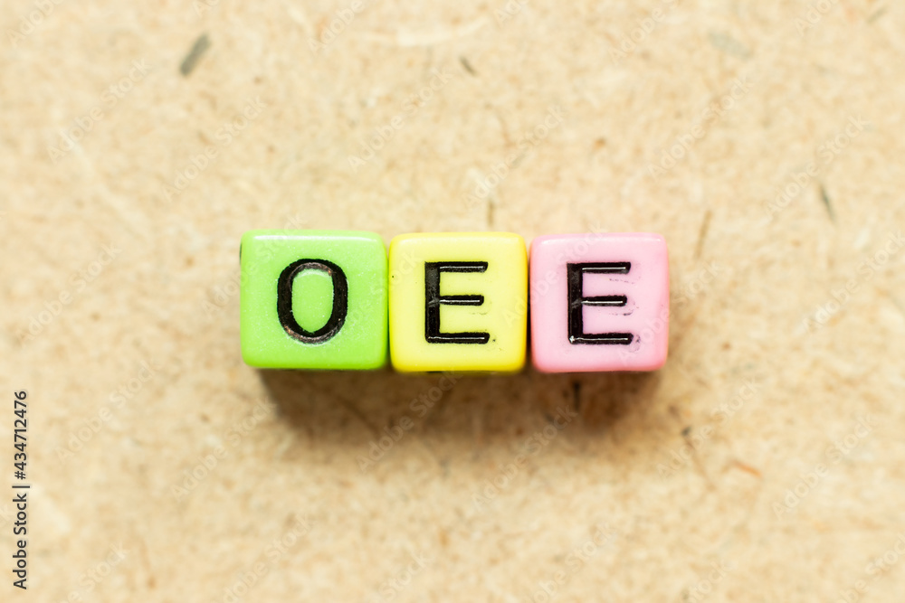 Color alphabet letter block in word OEE (abbreviation of overall ...