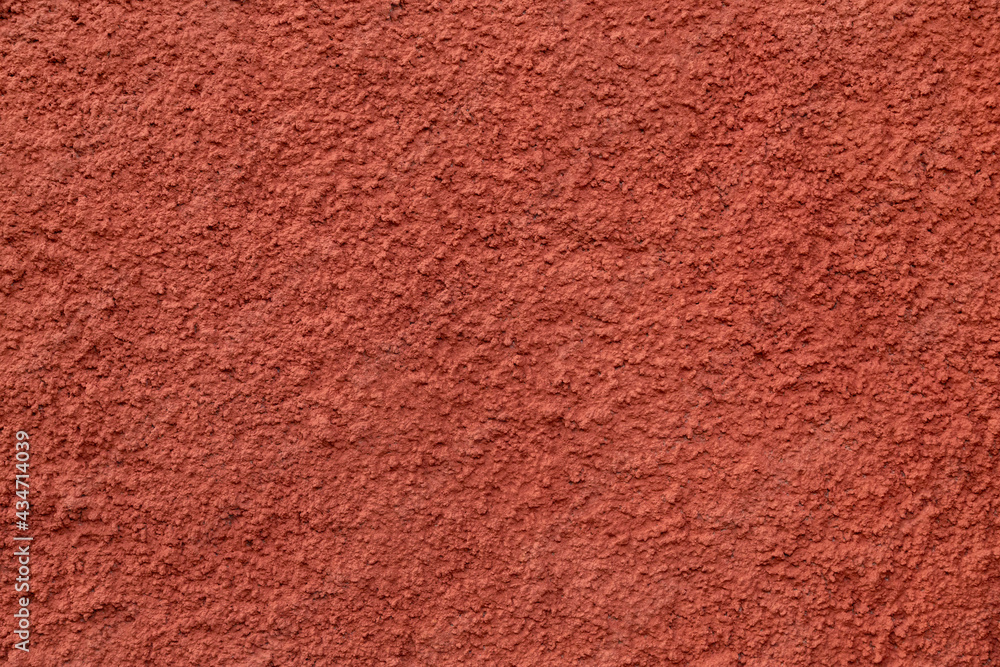 Decorative plaster of terracotta color with small pimples, wall surface ...