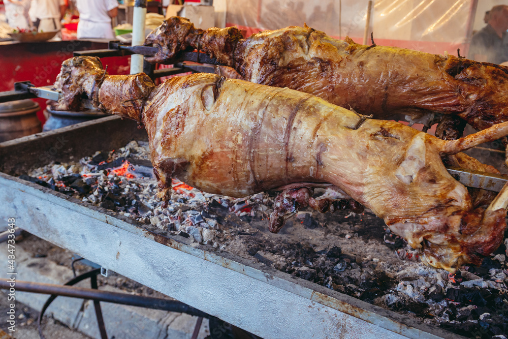 Food tent with roasted lamb during the Trumpet Festival in Guca village ...