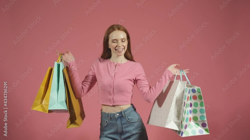 Excited with joyful emotions, the customer of a fashion store, a ...