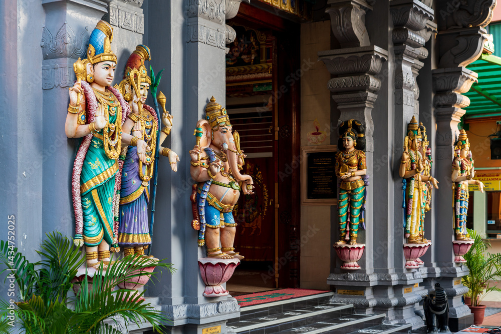 Colourful statues of Hindu religious deities adorning the interior of a ...
