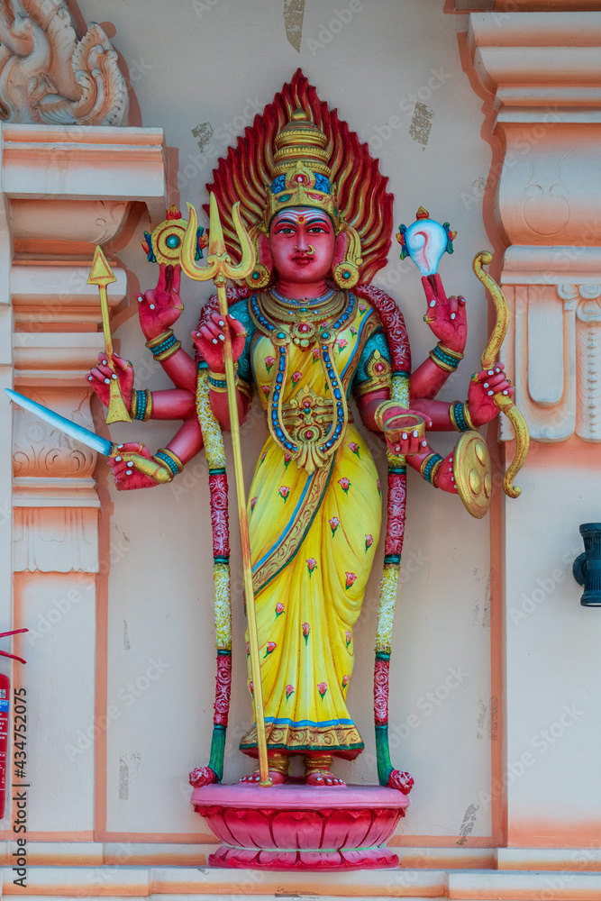 Colourful statues of Hindu religious deities adorning the interior of a ...