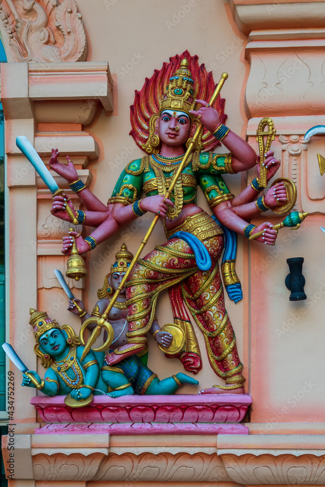 Colourful statues of Hindu religious deities adorning the interior of a ...