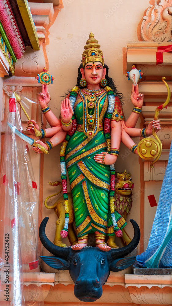 Colourful statues of Hindu religious deities adorning the interior of a ...