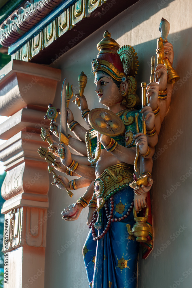 Colourful statues of Hindu religious deities adorning the interior of a ...