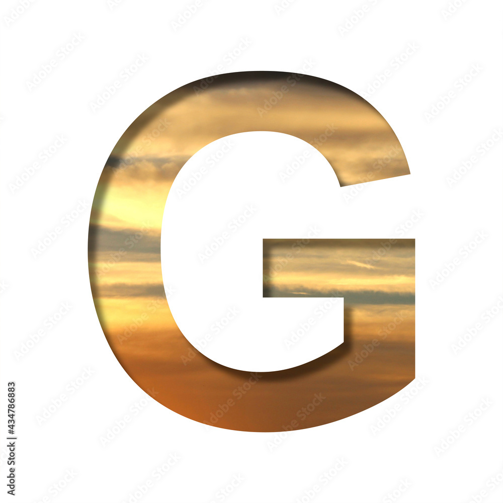 Foto de Font on the sunset sky. The letter G cut out of paper on the ...