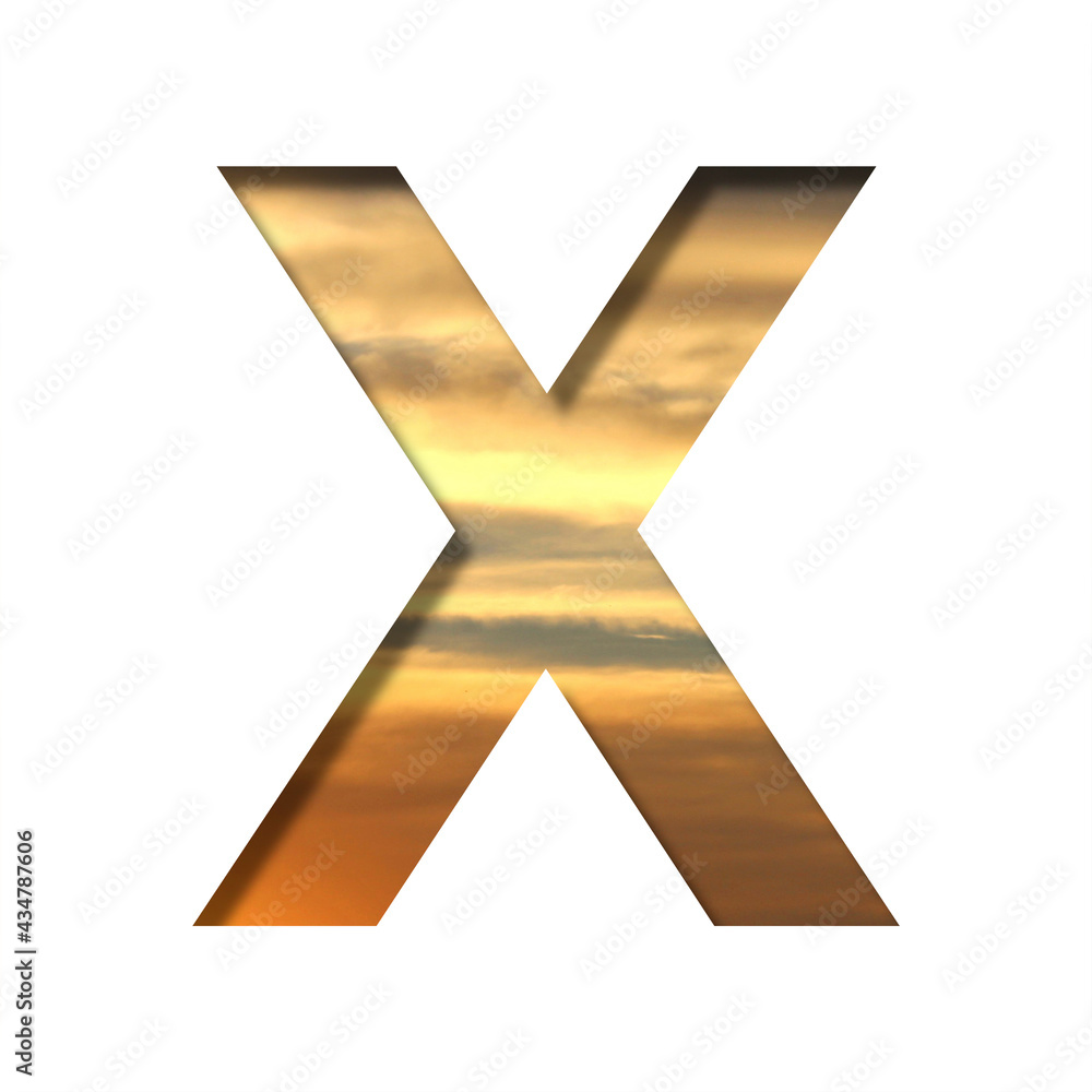 Font on the sunset sky. The letter X cut out of paper on the background ...