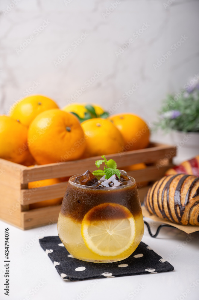 Iced Lemon Coffee with raspberry, Pain au chocolat and orange, ready to ...
