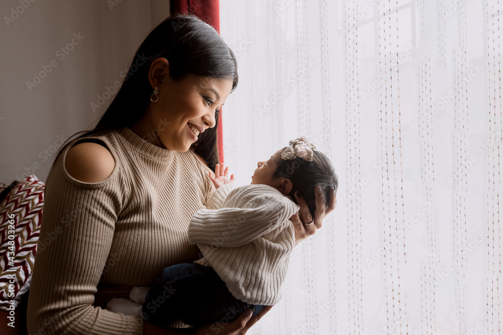 Proud Hispanic Mom Holding Her Newborn Baby - Latin Mother and Daughter at Home Stock Photo ...