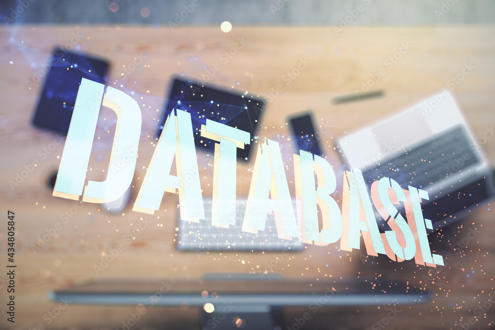 Double exposure of creative Database word hologram on laptop background ...