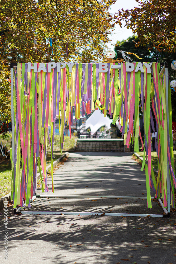 Foto de Beautiful colorful ribbons and happy birthday words hanging in ...