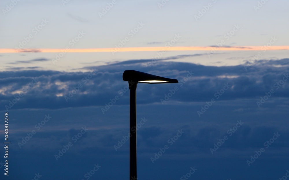 Isolated head of an led powered street lamp post at dusk Stock Photo ...