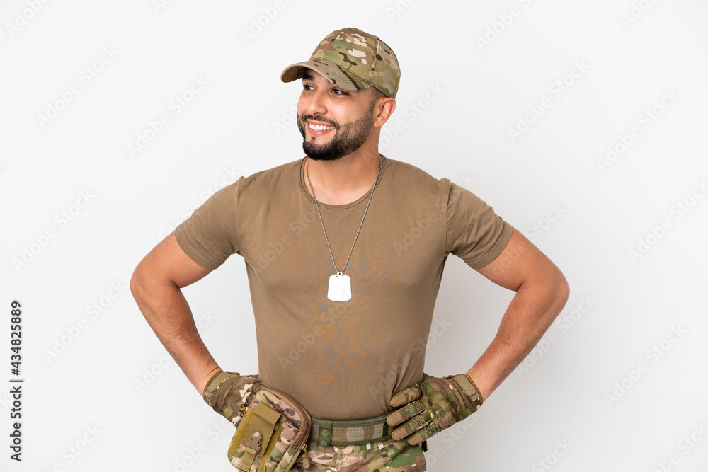 Young arab soldier man isolated on white background posing with arms at ...