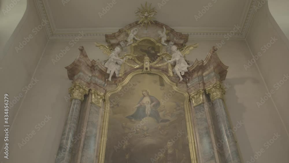 magnificent baroque altar with sculptures, columns, cross and ...