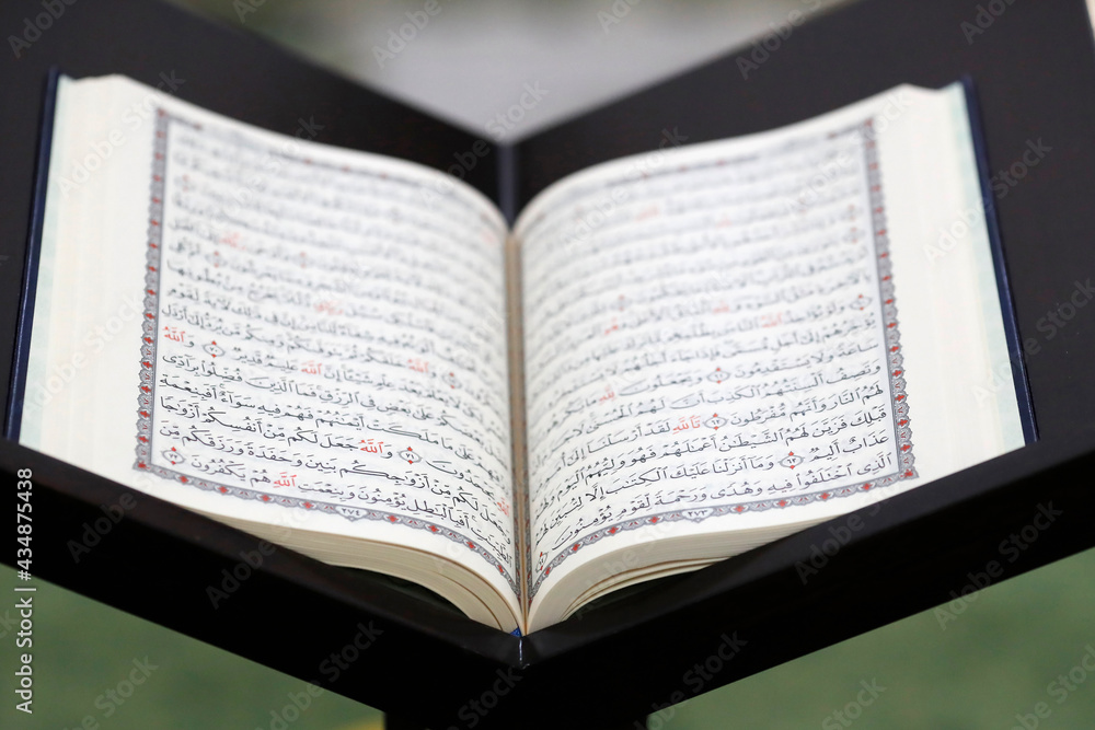 Islamic holy book Quran in mosque opened for reading and prayer. Dubai ...