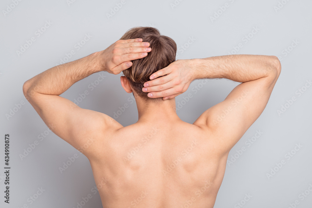 Backside photo of young blond man wash hair without clothes isolated on ...