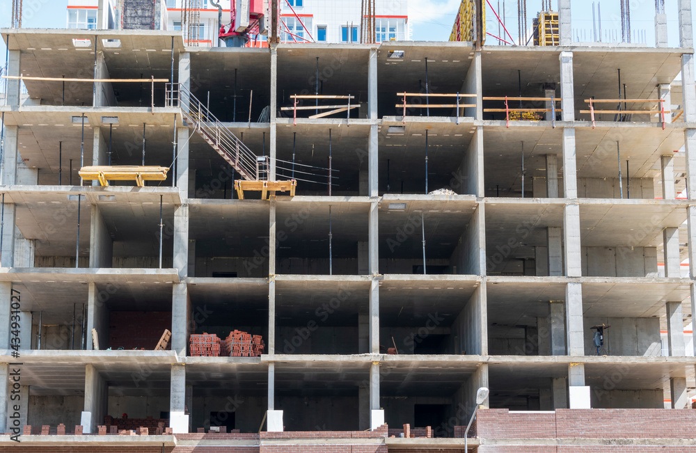 Construction of a multi-storey monolithic building. Concrete honeycomb ...