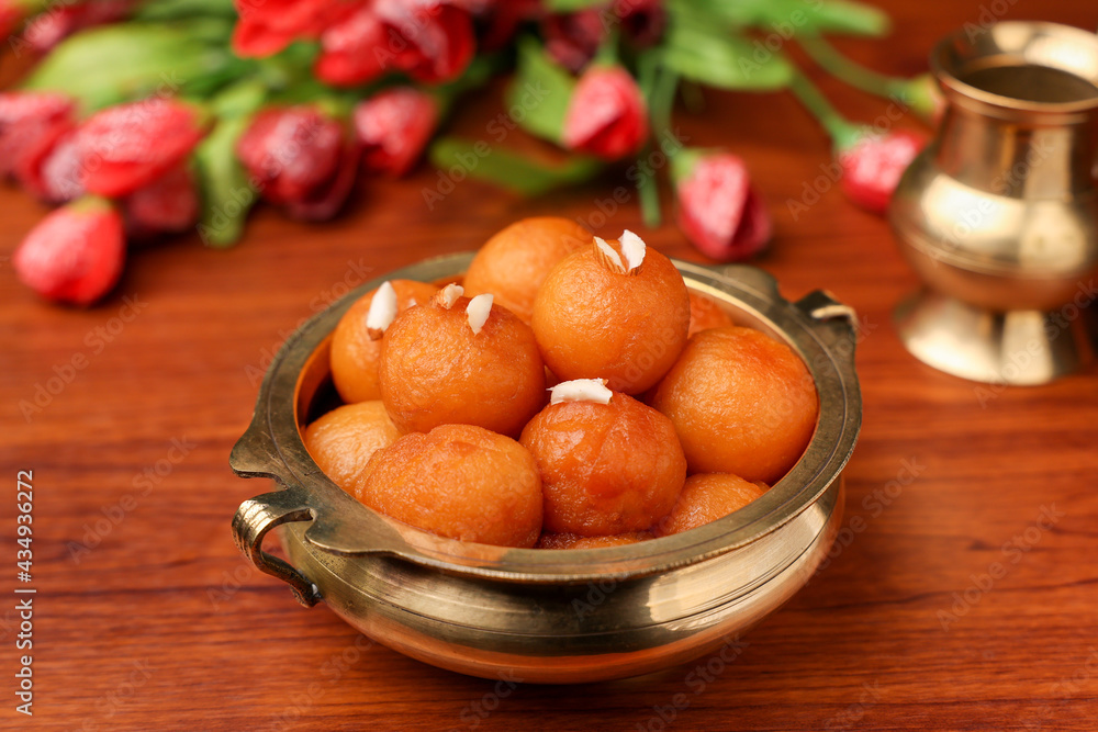 Gulab jamun , gulaab jamun in sugar syrup golden bowl Indian sweet food ...