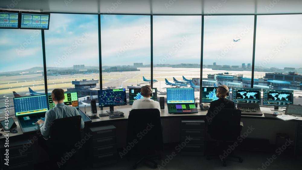 Diverse Air Traffic Control Team Working in a Modern Airport Tower ...