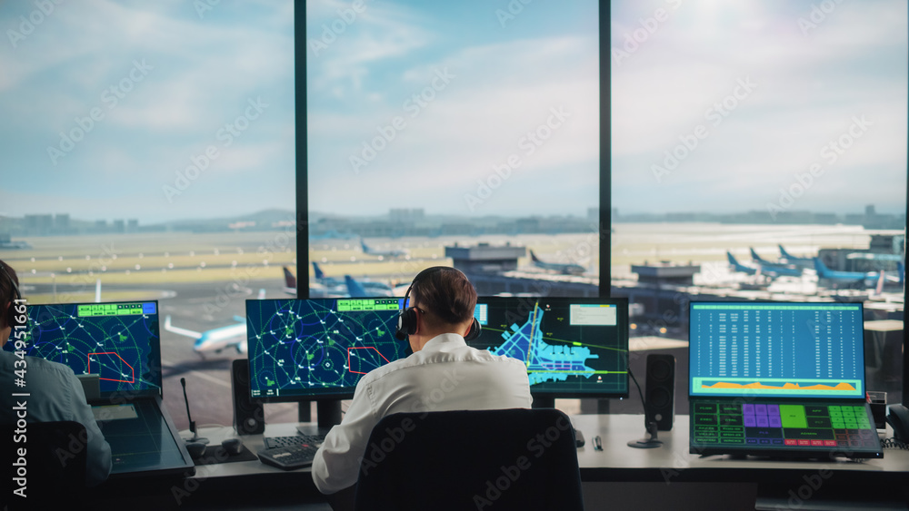Diverse Air Traffic Control Team Working in a Modern Airport Tower ...